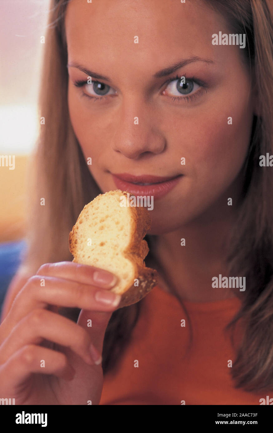 Woman faces bread hi-res stock photography and images - Alamy
