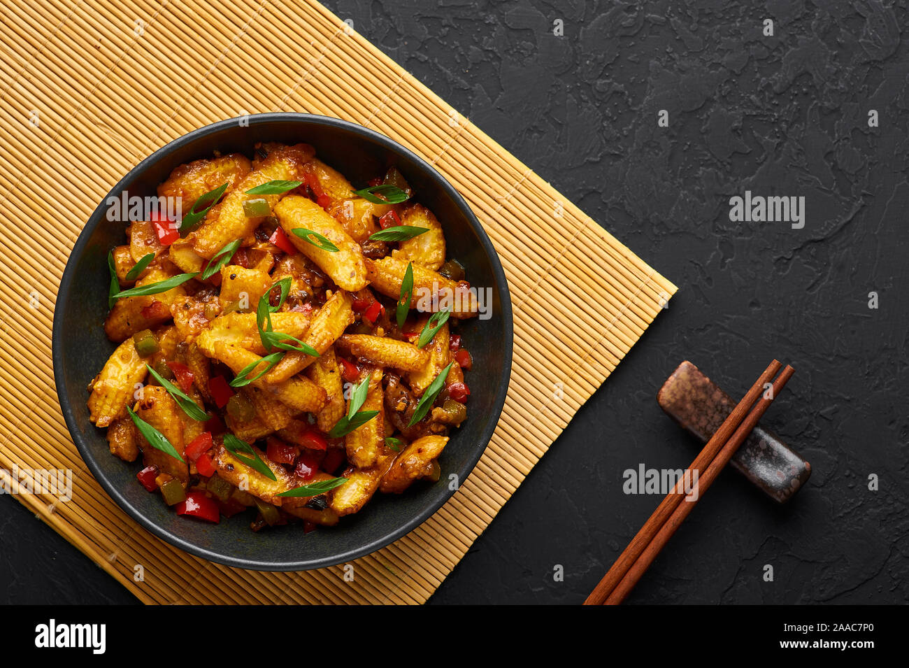 Baby Corn Manchurian dry looks like Schezwan Baby Corn in black bowl at ...
