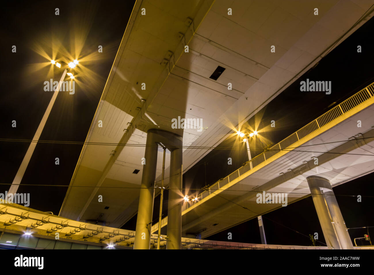 Bridge from below with two big lanterns at night Stock Photo - Alamy