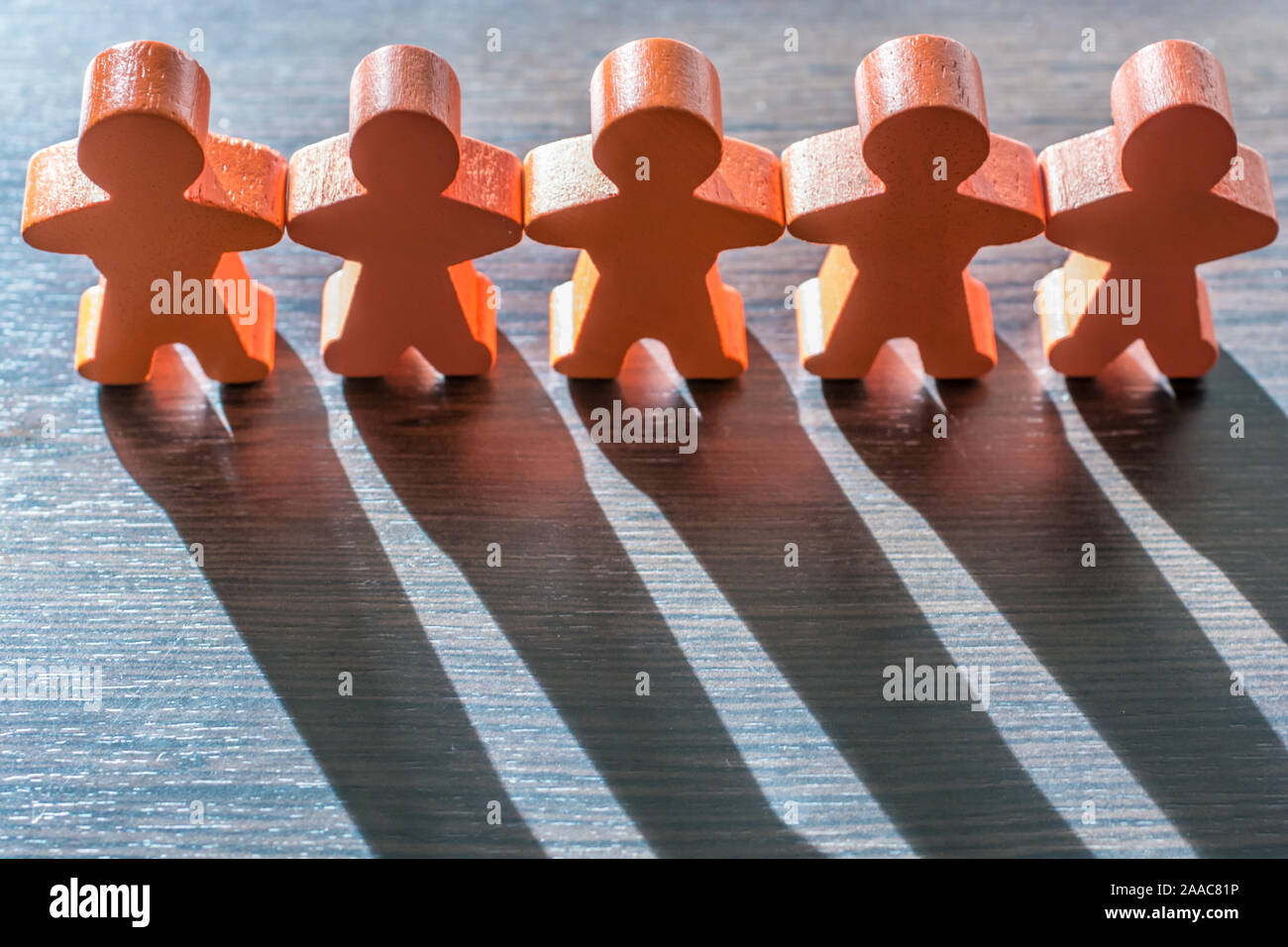 Wooden background with human chain Stock Photo - Alamy