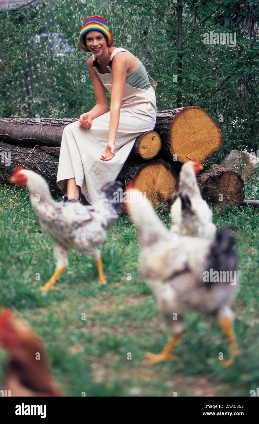 woman with hens, outdoors Stock Photo - Alamy