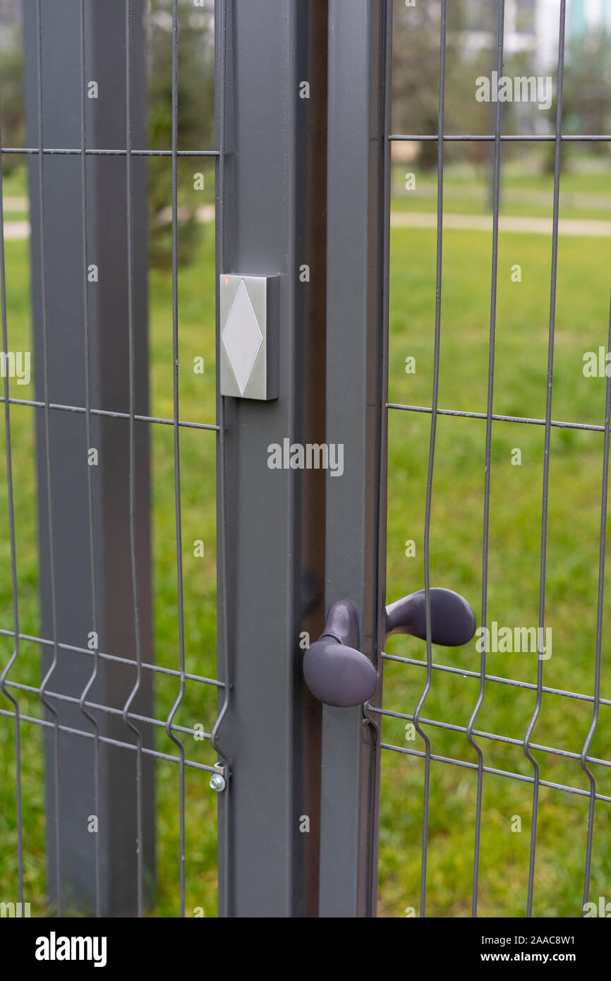 safety in modern residential buildings. fenced yard, closed gate with ...