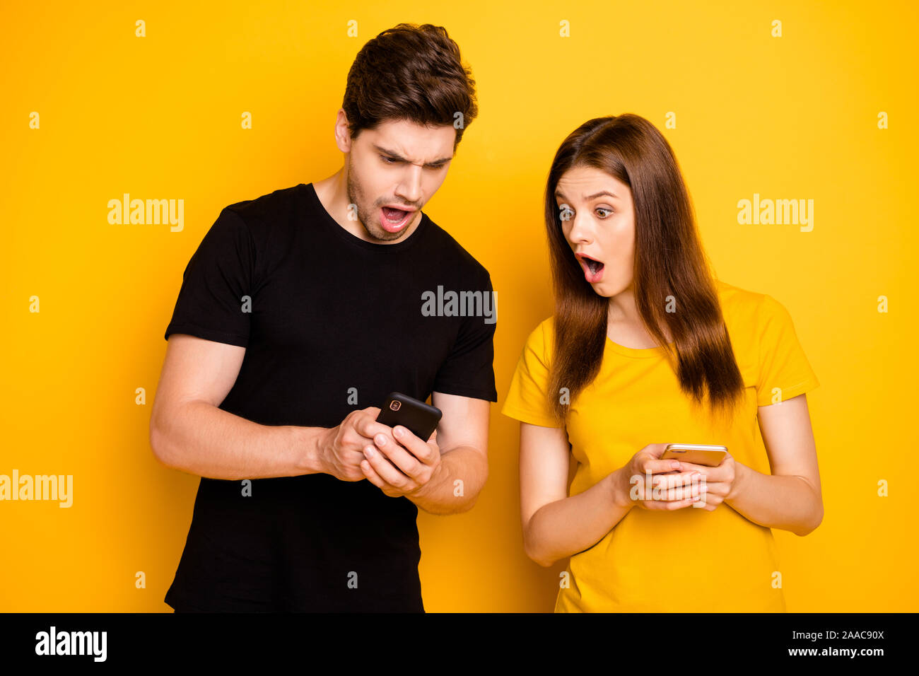 Photo of two people outraged angry seeing fake news spreading browsing ...