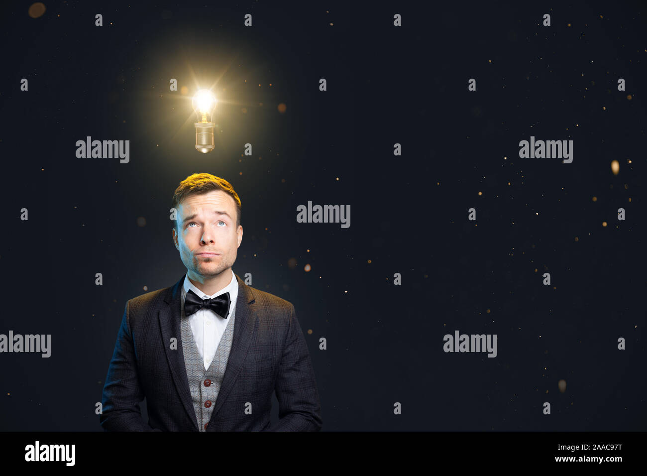 Well-dressed man with a light bulb above the head Stock Photo - Alamy