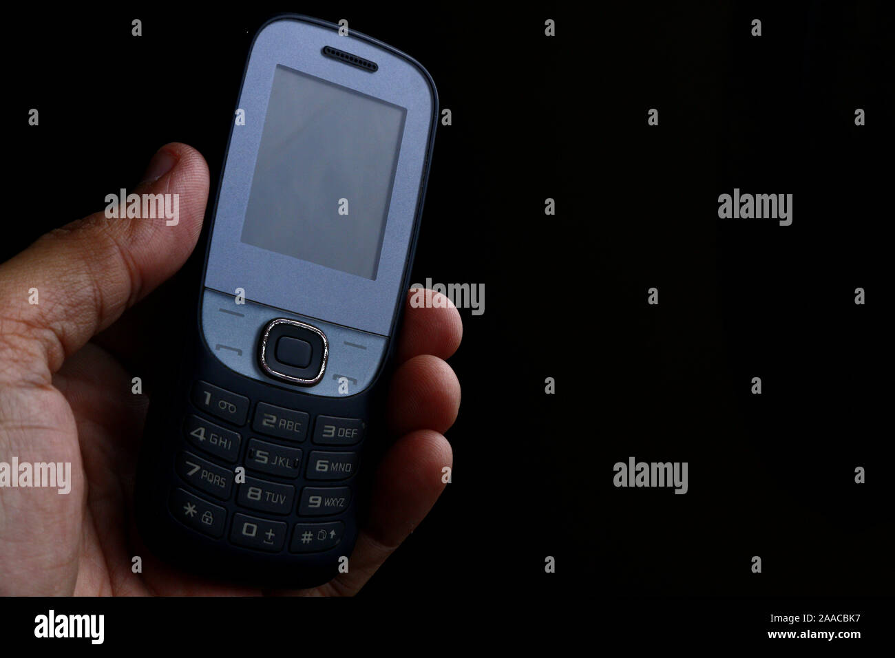 Photo of old and used mobile phone with keypad Stock Photo - Alamy