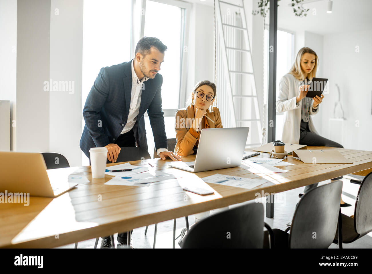 Group of a young office employees dressed casually in the suits having ...