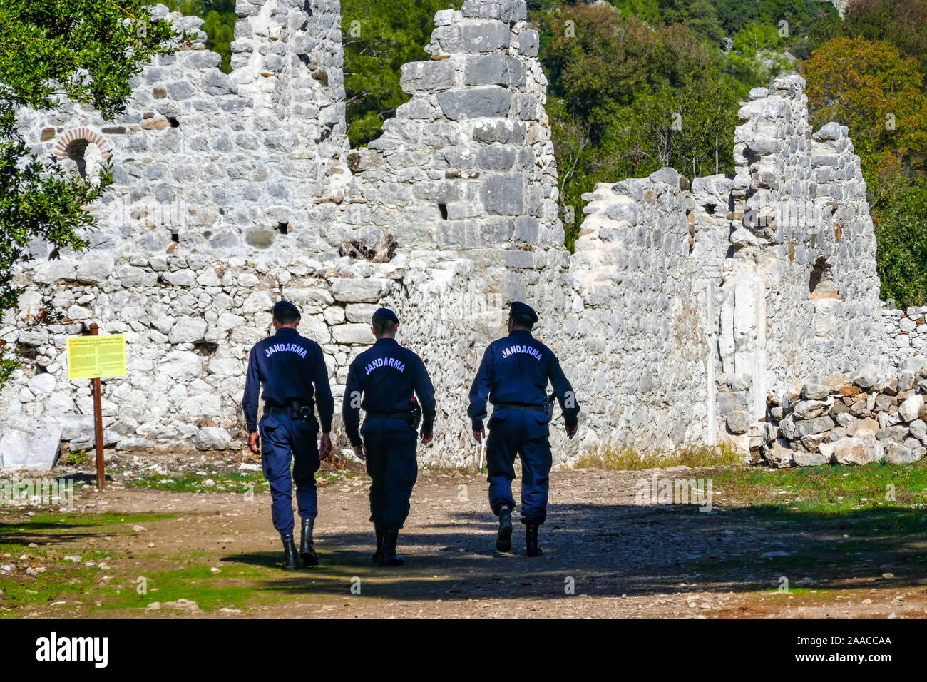 Three armed security guards at Ancient Roman ruins of Olimpos, Antalya ...