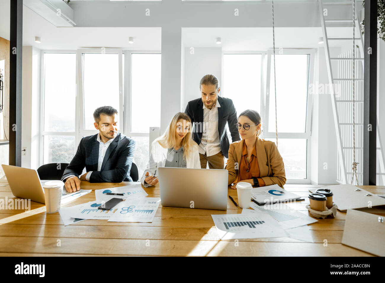 Group of a young office employees dressed casually in the suits having ...