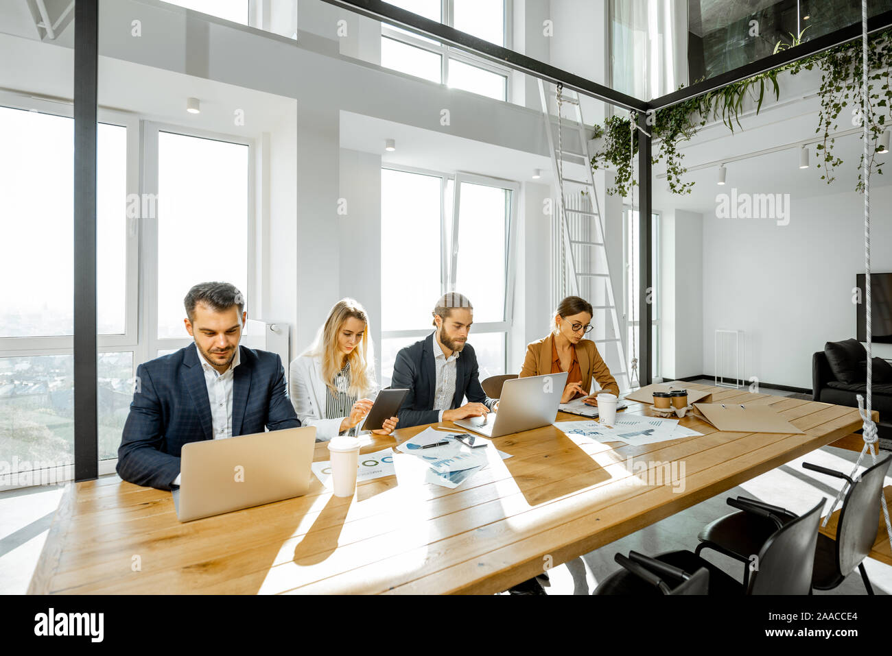 Office employees dressed casually in the suits networking with ...