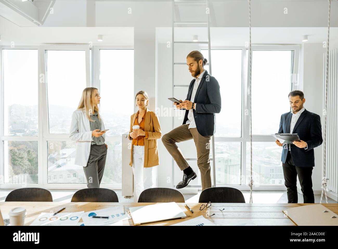 Group of a young creative office employees having some informal ...