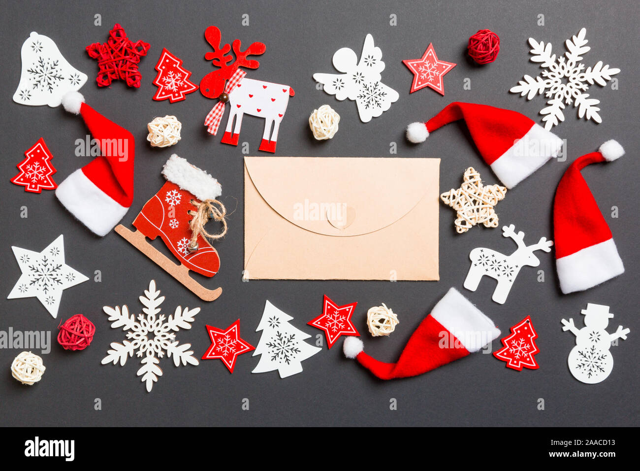 Top view of craft envelope. New Year decorations on black background ...