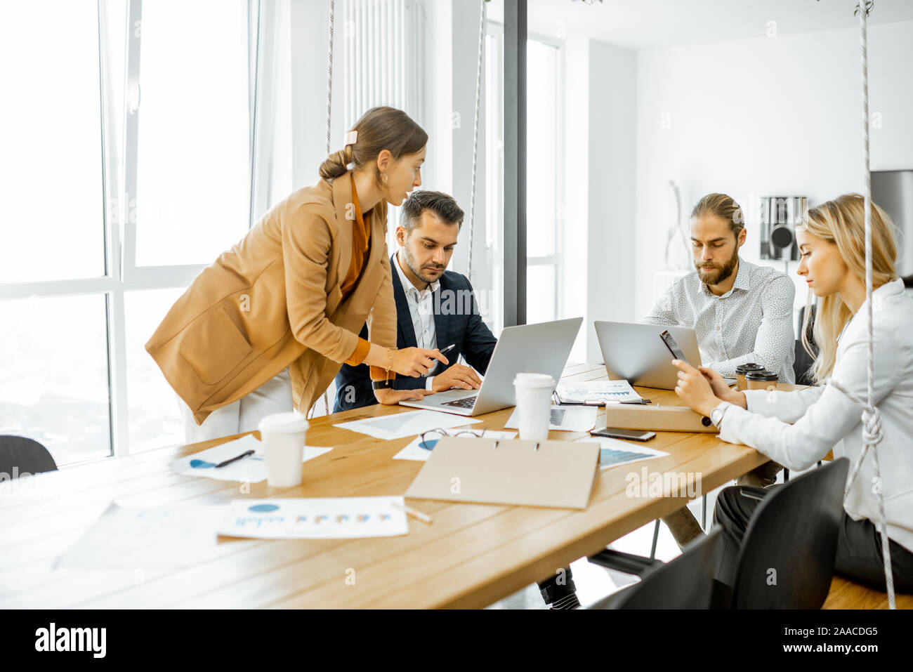 Group of a young office employees dressed casually in the suits having ...