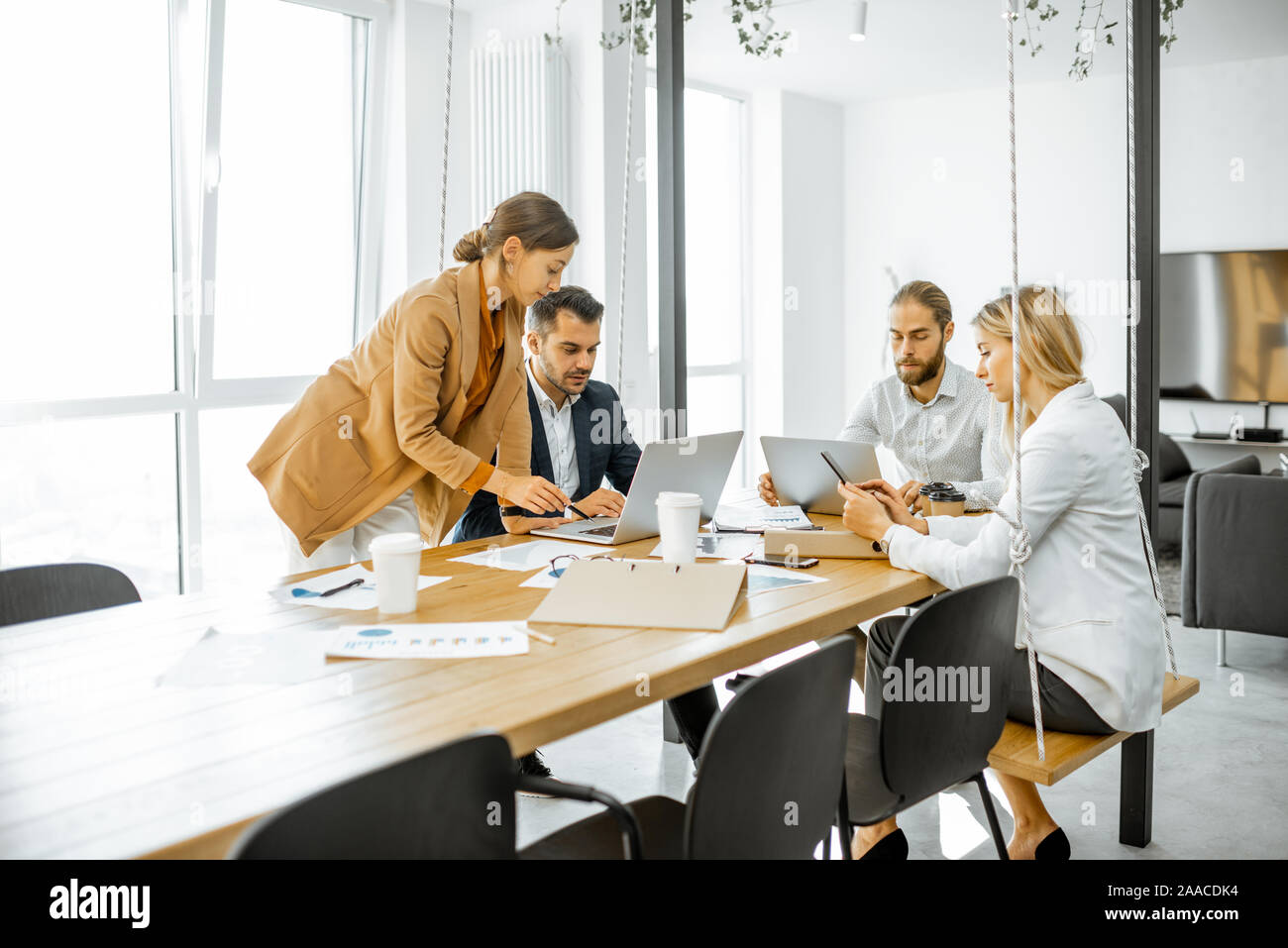 Group of a young office employees dressed casually in the suits having ...