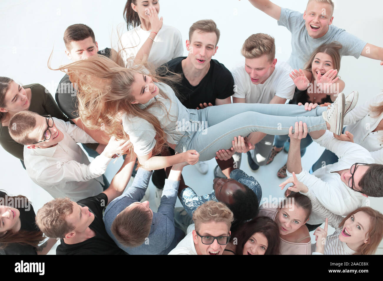 close up. happy young team honoring their leader Stock Photo - Alamy