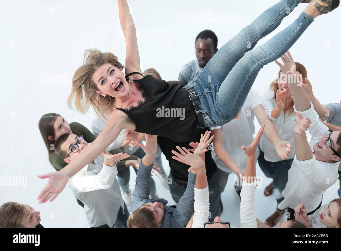 close up. merry team rocking their leader Stock Photo - Alamy