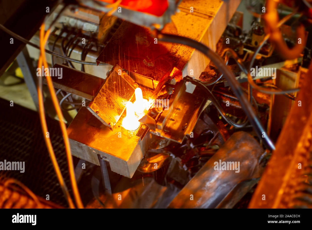 . Glass industry. Burning blanks of glass bottles in an industrial ...