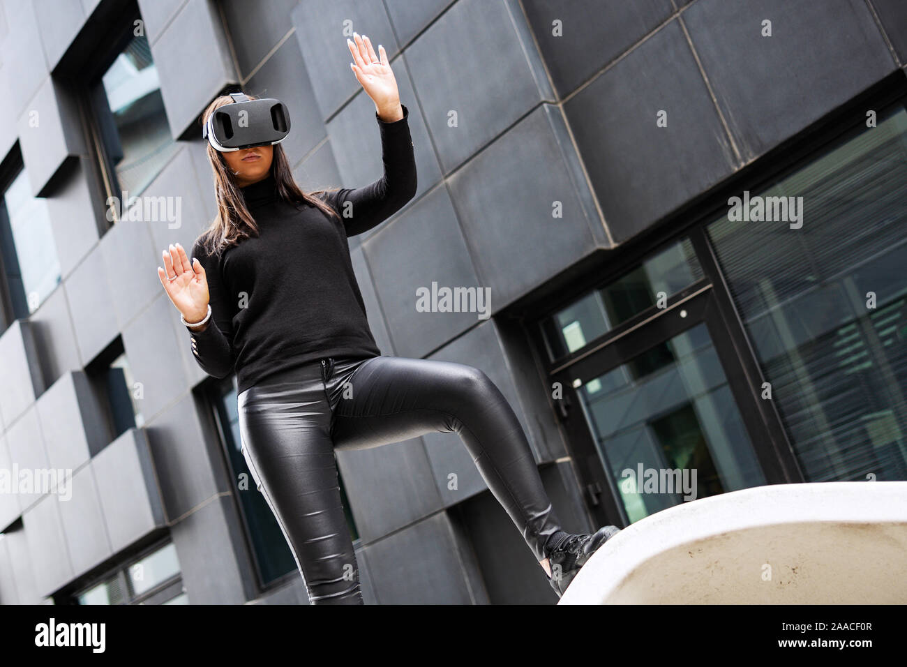 Woman Wearing Virtual Reality Glasses And Black Outfit In Futuristic ...