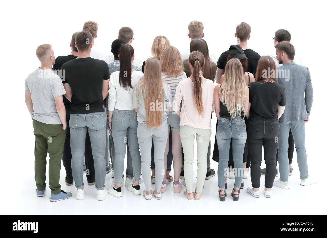rear view. group of young people standing in front of blank screen ...