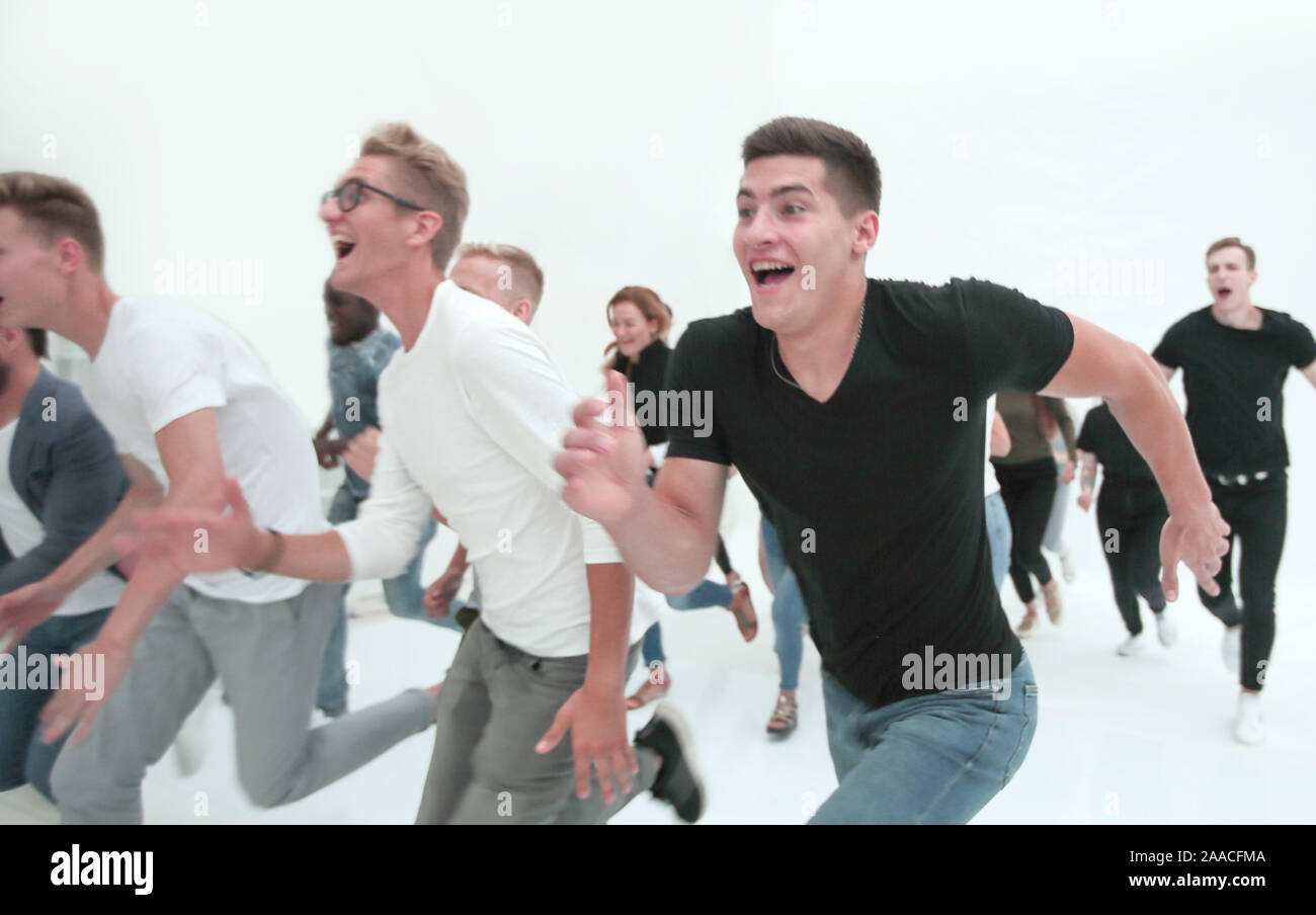 in full growth. a group of young people running forward Stock Photo - Alamy