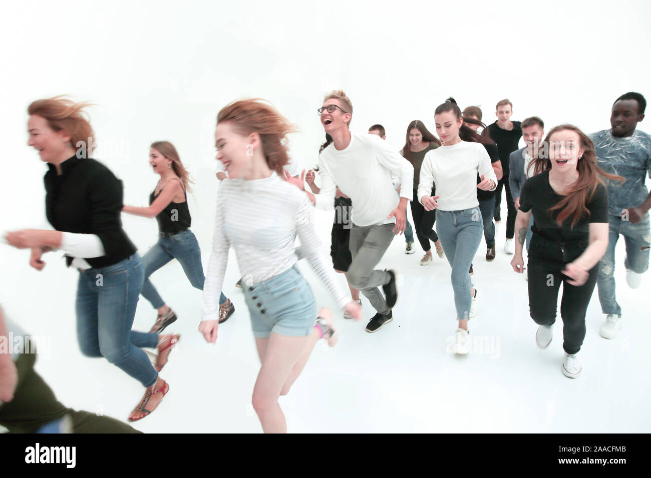 in full growth. a group of young people running forward Stock Photo - Alamy