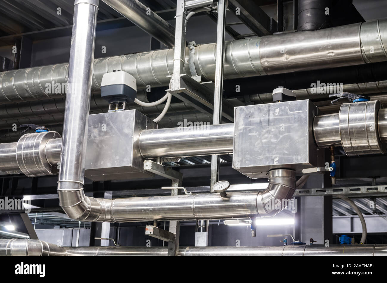 Pipes and other building services in a industrial building Stock Photo ...