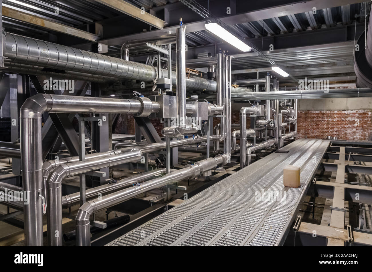 Pipes and other building services in a industrial building Stock Photo ...