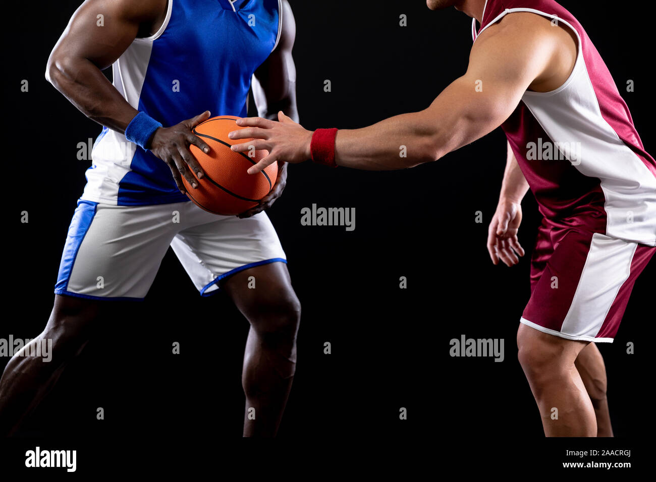 Basketball players in action Stock Photo - Alamy