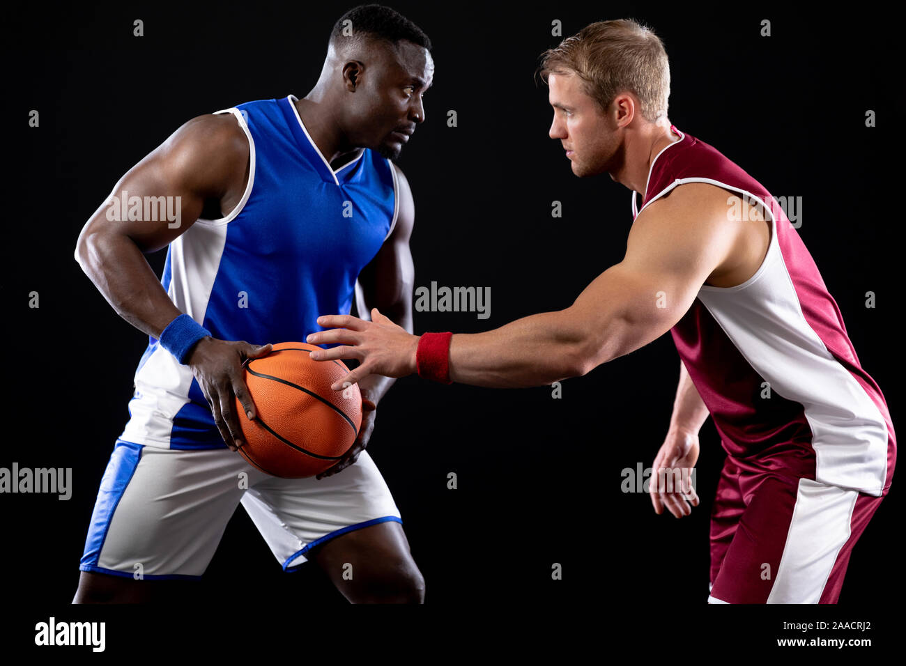 Basketball players in action Stock Photo - Alamy