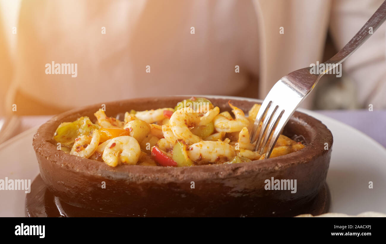 Woman fry shrimp in skillet hi-res stock photography and images - Alamy