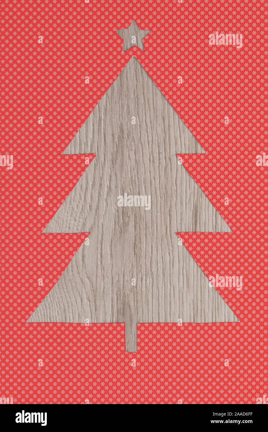 Christmas Tree Paper Shape With Wooden Background Stock Photo - Alamy