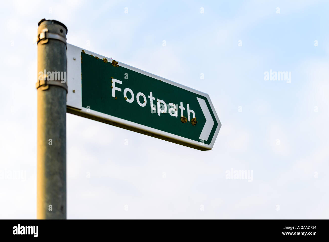 metal footpath sign over sky background in uk Stock Photo - Alamy