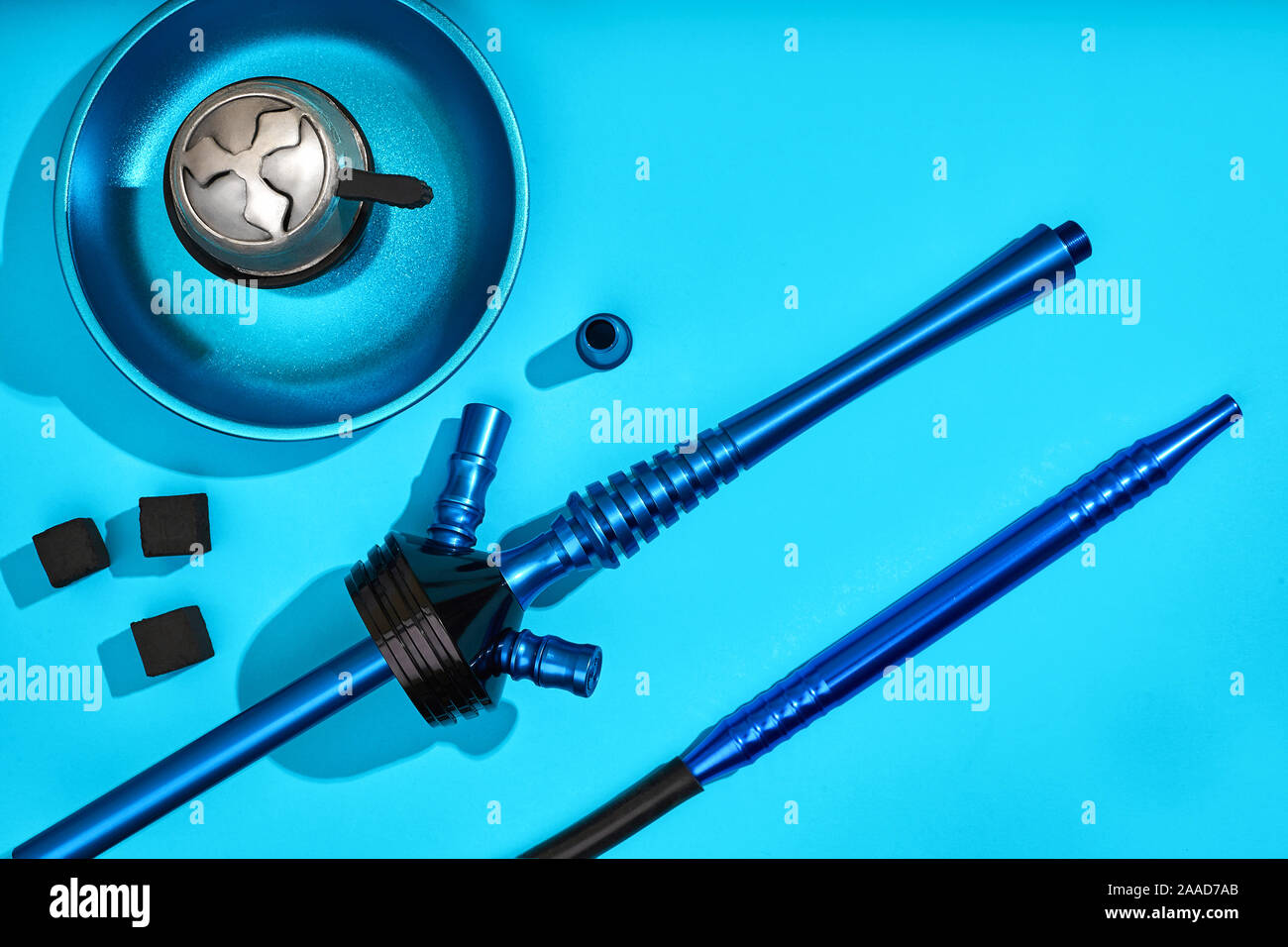 Parts of blue decorated hookah or shisha on light blue backgroun Stock ...