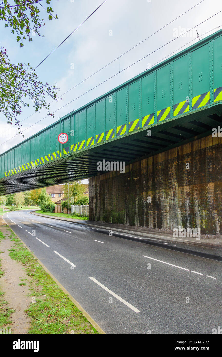 railway bridge with road underneath in england uk Stock Photo - Alamy