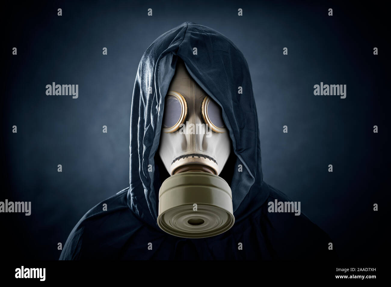Man in a gas mask and hooded cloak. Environment pollution Stock Photo ...