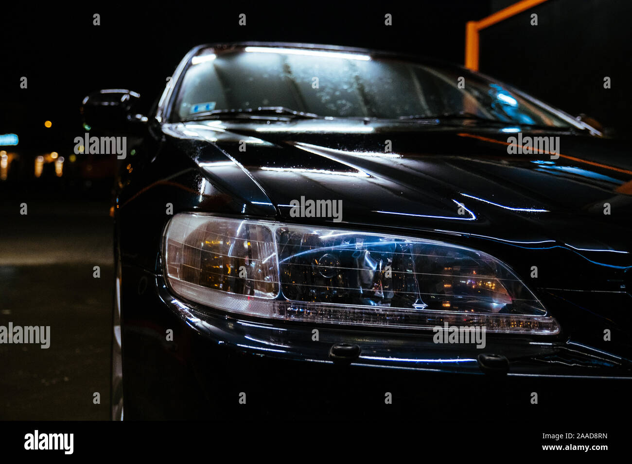 Carwash night time black car and lamp illumination Stock Photo - Alamy