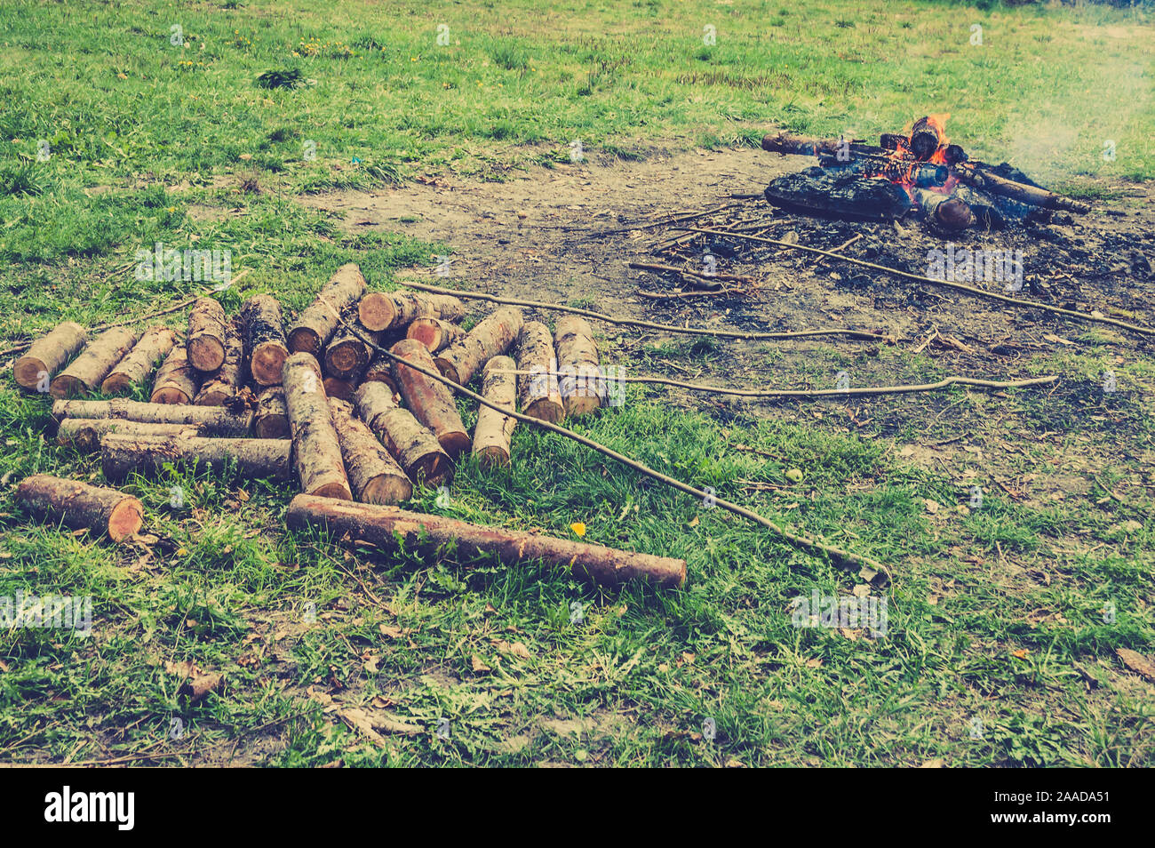 Rustic bonfire outdoors, vintage photo Stock Photo - Alamy