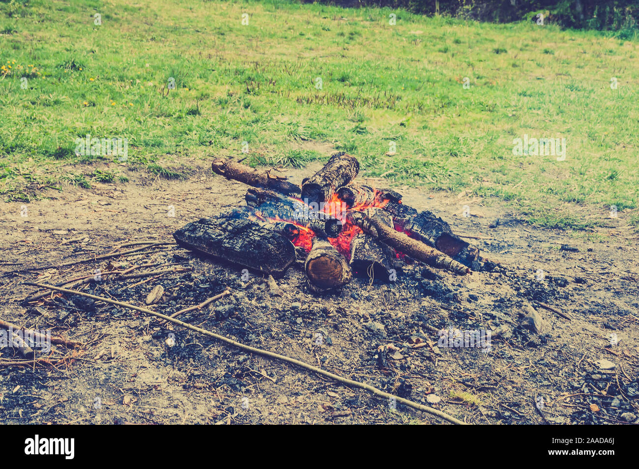 Rustic bonfire outdoors, vintage photo Stock Photo - Alamy