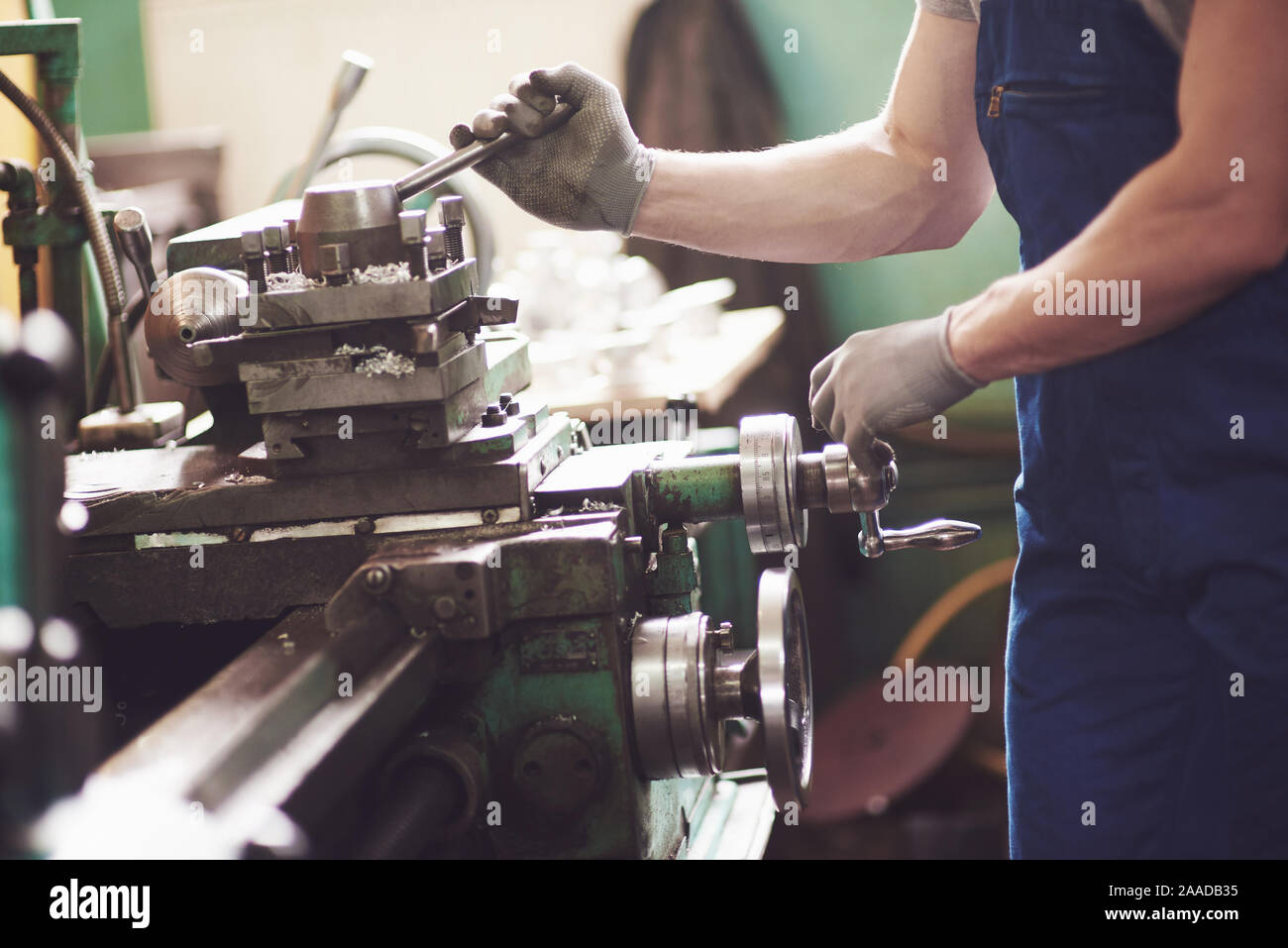 Portrait of a young master working at a factory Stock Photo - Alamy