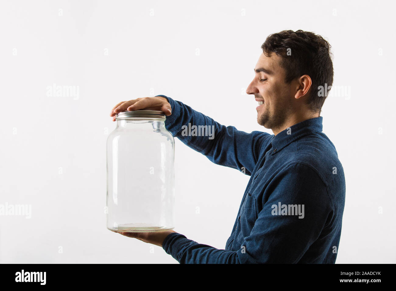 Close up profile portrait of a curious businessman holding an empty ...