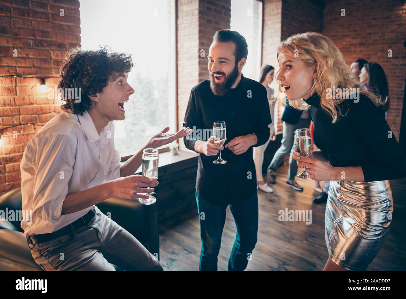 Photo of cheerful positive people listening to speech of their friend ...