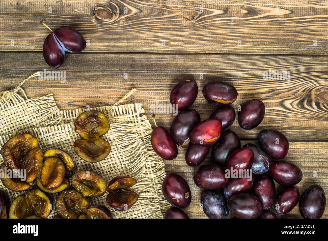 Fresh prune plums on wood background Stock Photo - Alamy