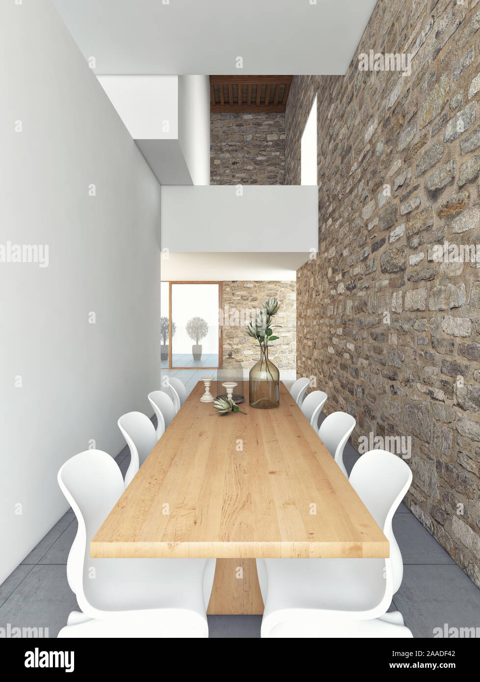 table in the room with stone wall Stock Photo - Alamy