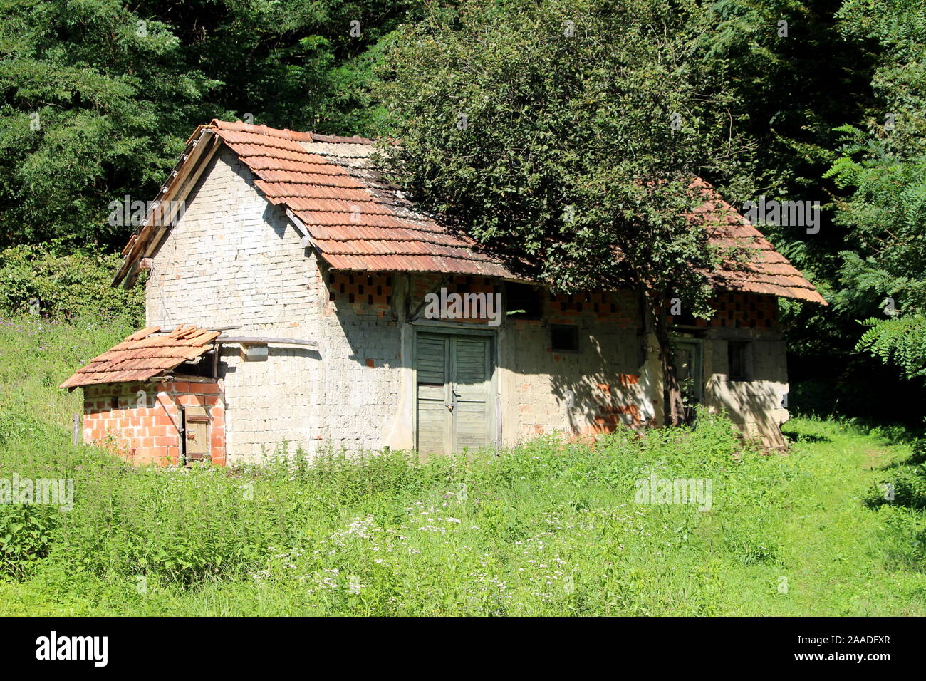 Abandoned old dilapidated red brick and building blocks outdoor storage ...
