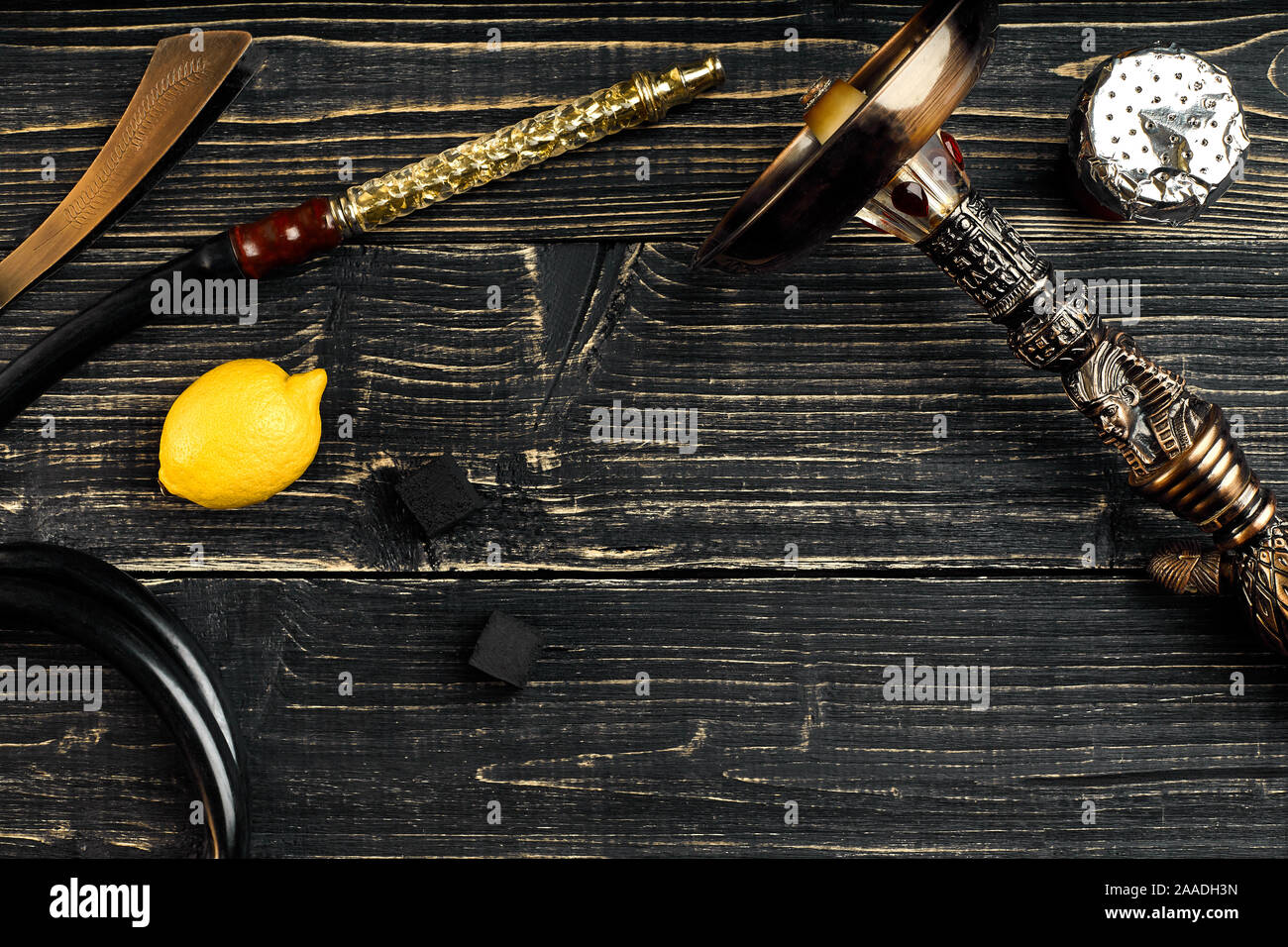 Dismantled parts of hookah on a wooden background with lemon fru Stock ...