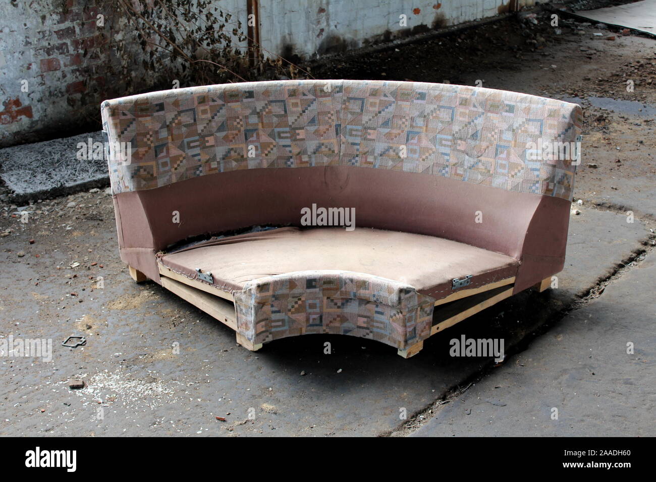Broken cracked destroyed family house couch left at abandoned building ...