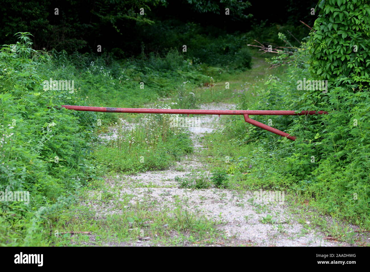 Closed and locked rusted metal ramp blocking entrance to local forest ...
