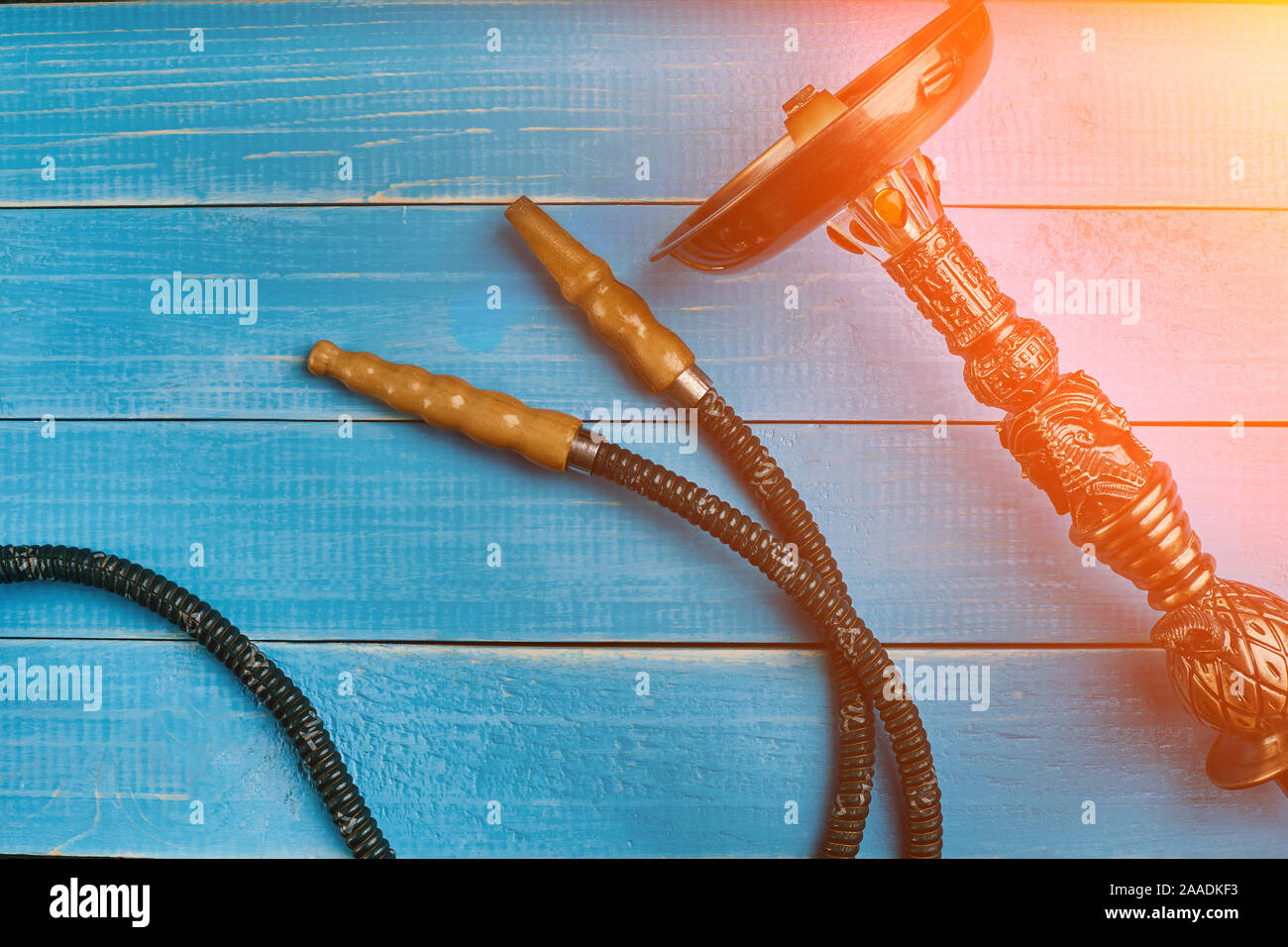 Parts of the hookah on blue wooden background. Hookah accessorie Stock ...