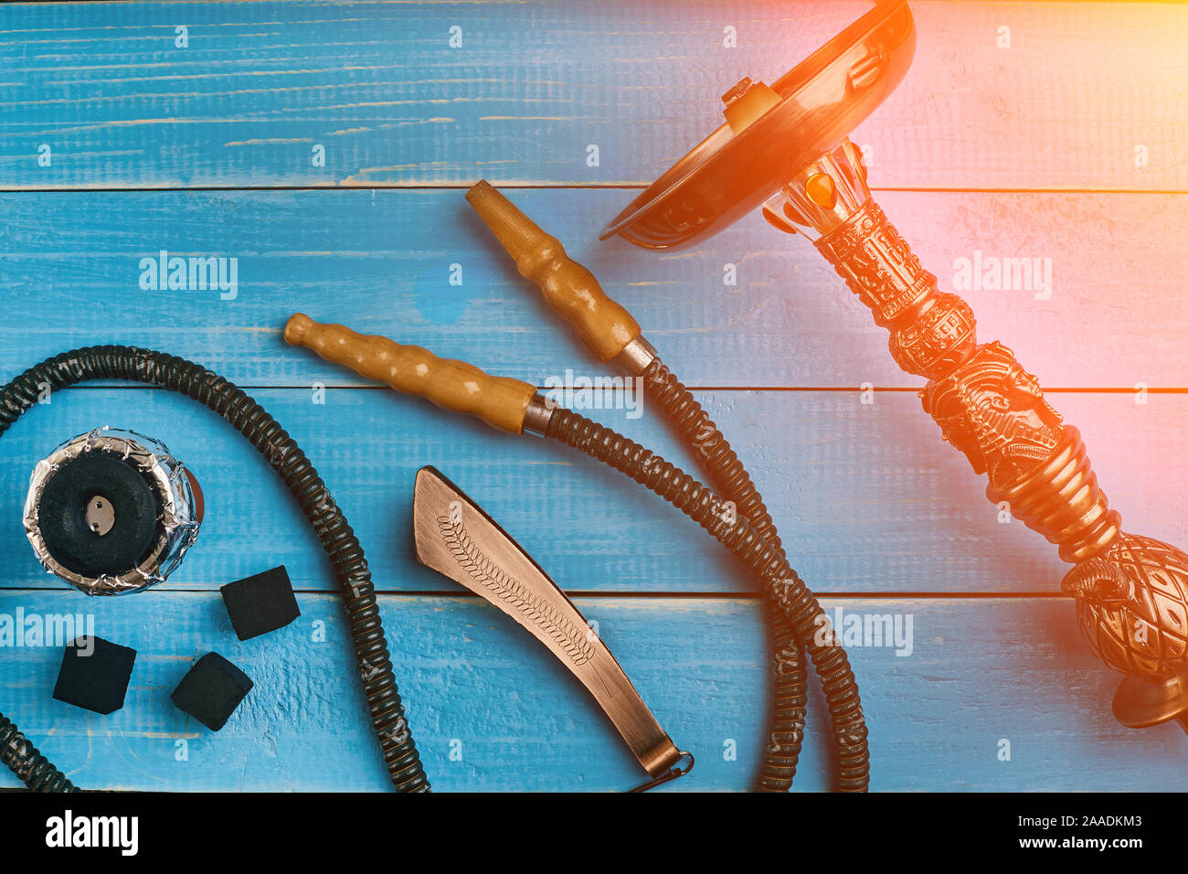 Parts of the hookah on blue wooden background. Hookah accessorie Stock ...