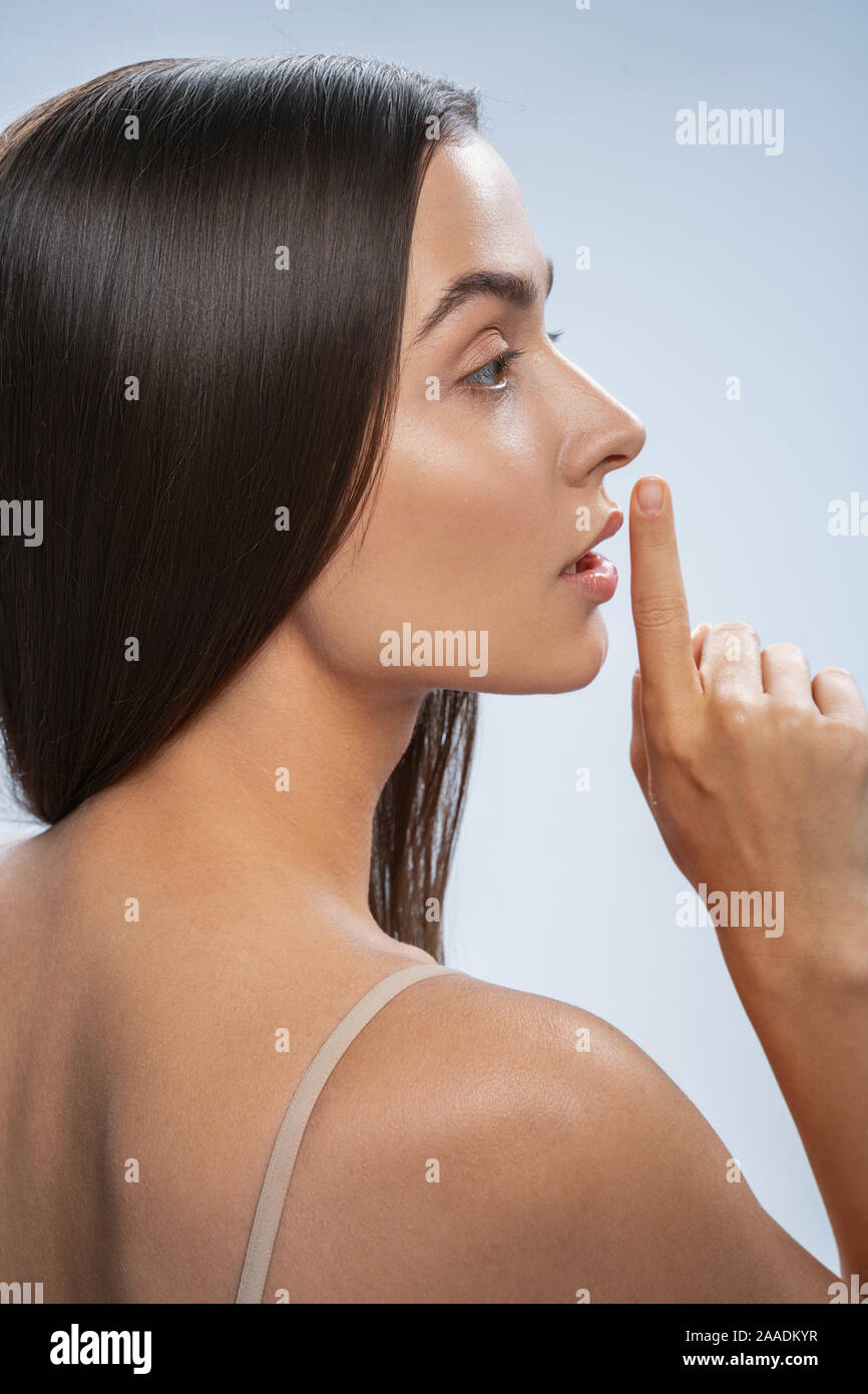 Portrait of cute girl that keeping silence Stock Photo - Alamy