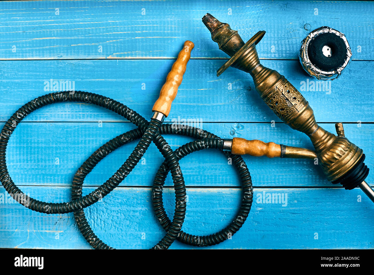 Parts of the hookah on blue wooden background. Hookah accessorie Stock ...